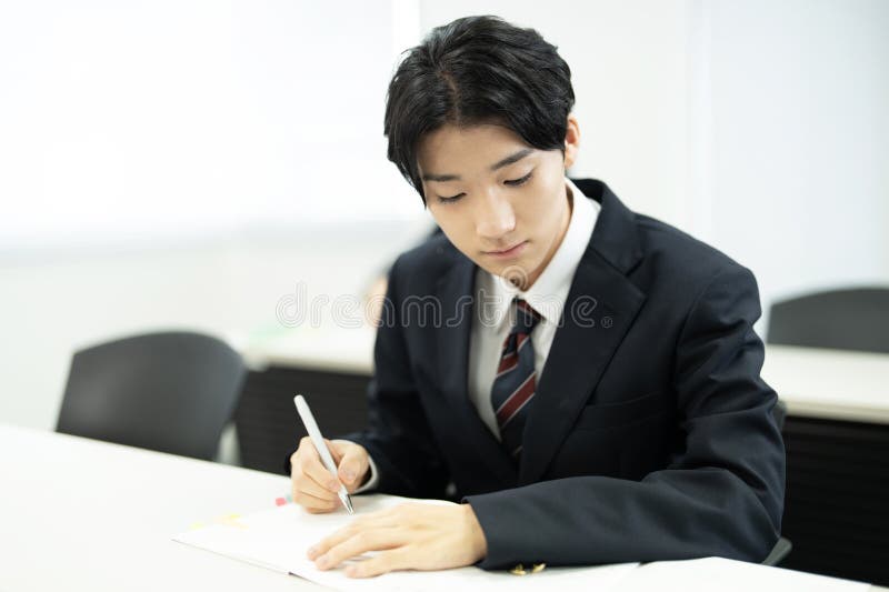Asian Teenage Boy in High School Uniform Studying in Class Stock Image ...