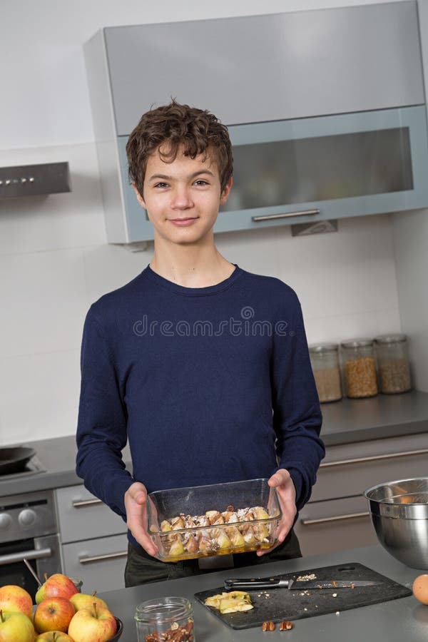 Teenage Boy in the kitchen stock image. Image of modern - 65173211