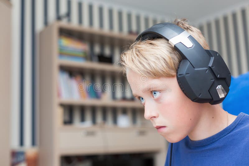 Teenage Boy Playing Computer Games on PC Stock Photo - Image of ...