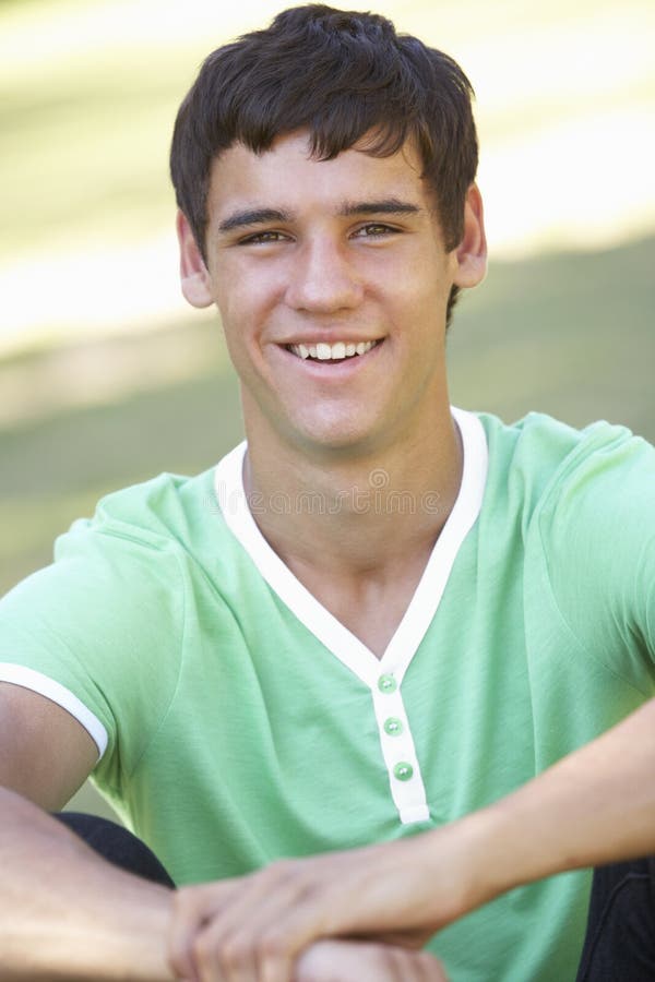 Teenage Boy Relaxing in Park Stock Photo - Image of teenager, teenage ...