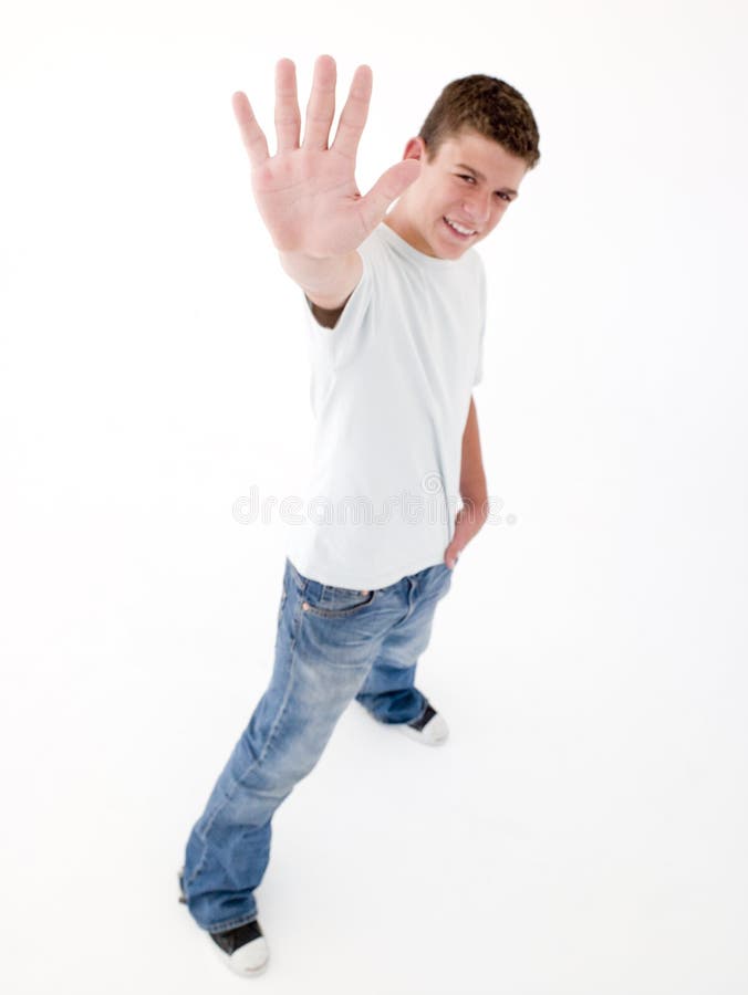 Teenage Boy Standing with Hand Up Smiling Stock Photo - Image of ...