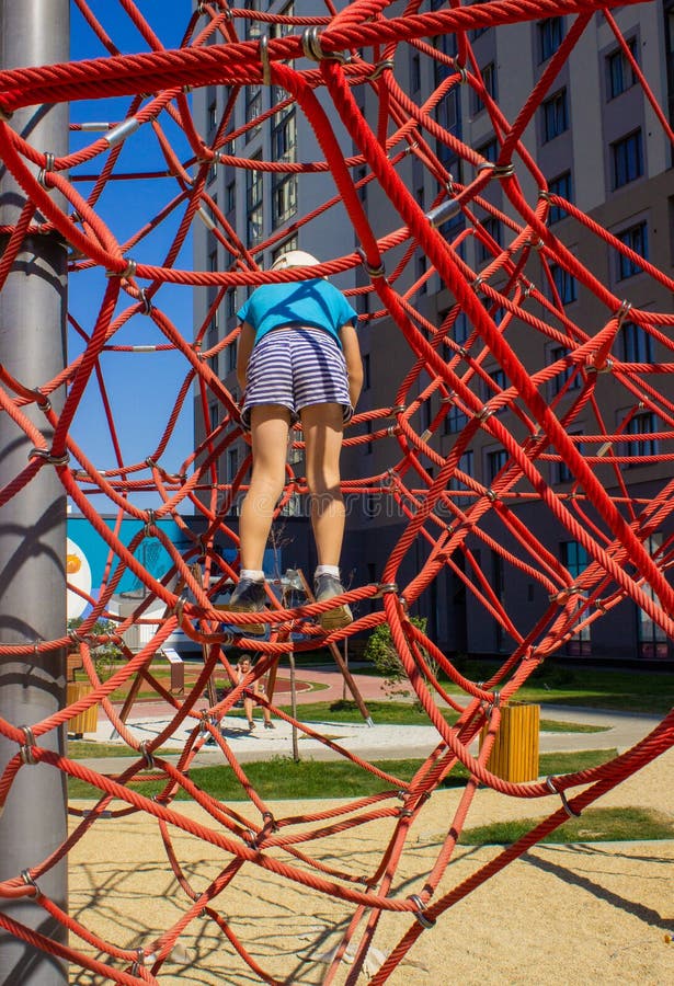 Teenage Boy Try To Walking on Spider Web. she is Playing on the Spider ...