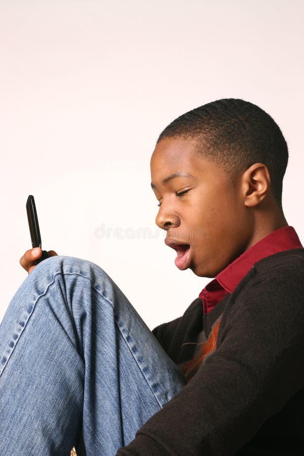 Teenage Boy Using Cell Phone Stock Photo - Image of cell, student: 1986334