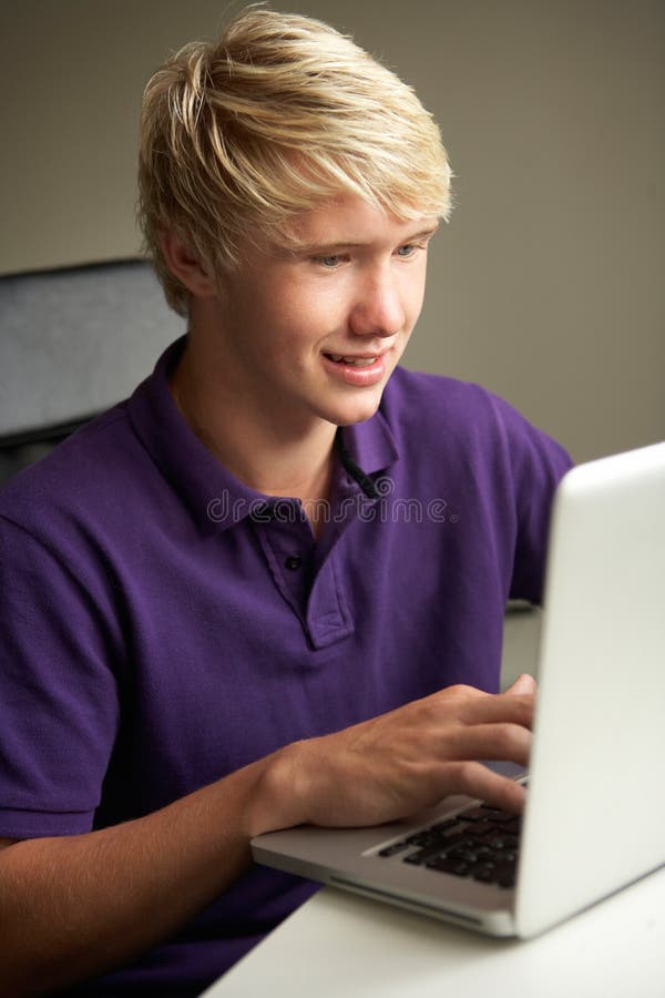 Teenage Boy Using Laptop at Home Stock Image - Image of laptop, female ...