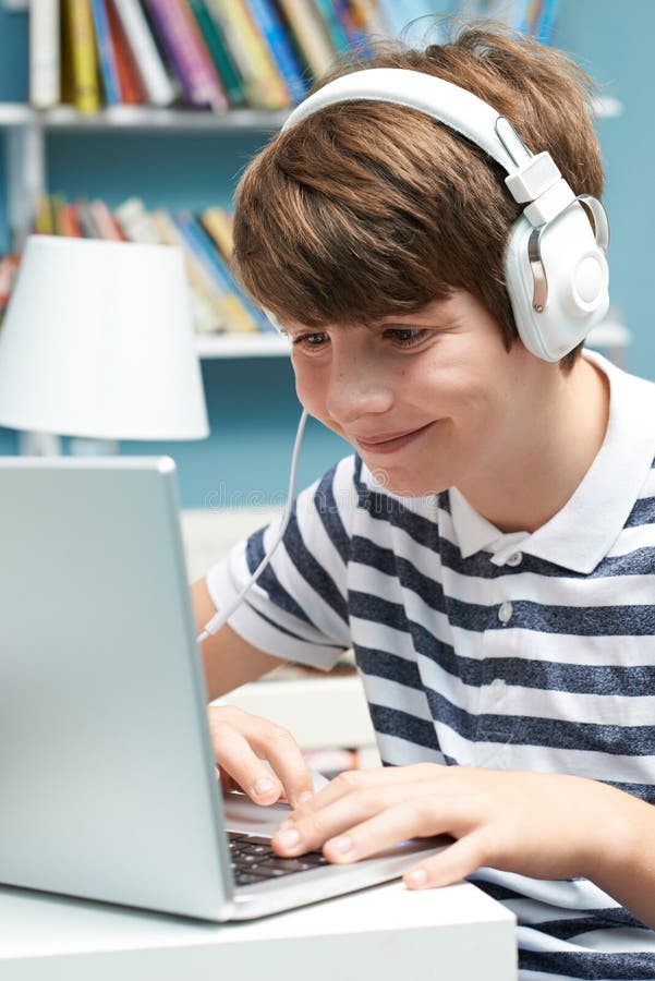 Teenage Boy Using Technology in Bedroom Stock Photo - Image of teen ...