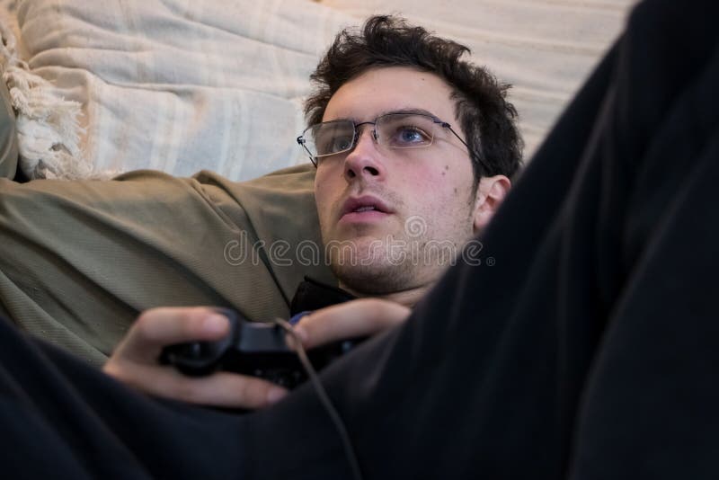 Boy Using Video Game Controller Stock Image - Image of lazy ... Boy Using Video Game Controller Stock Image - Image of lazy ...