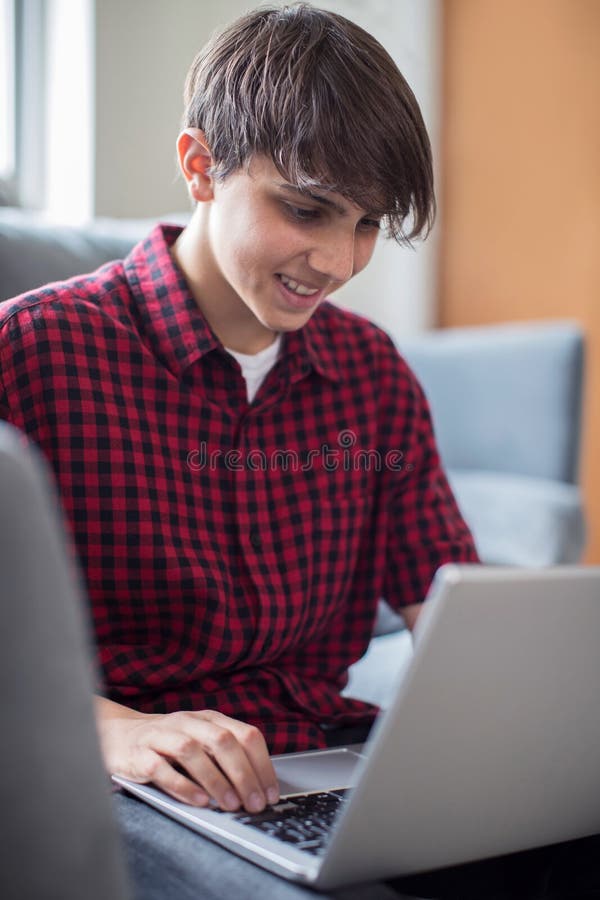 Teenage Boy Working on Laptop at Home Stock Photo - Image of social ...