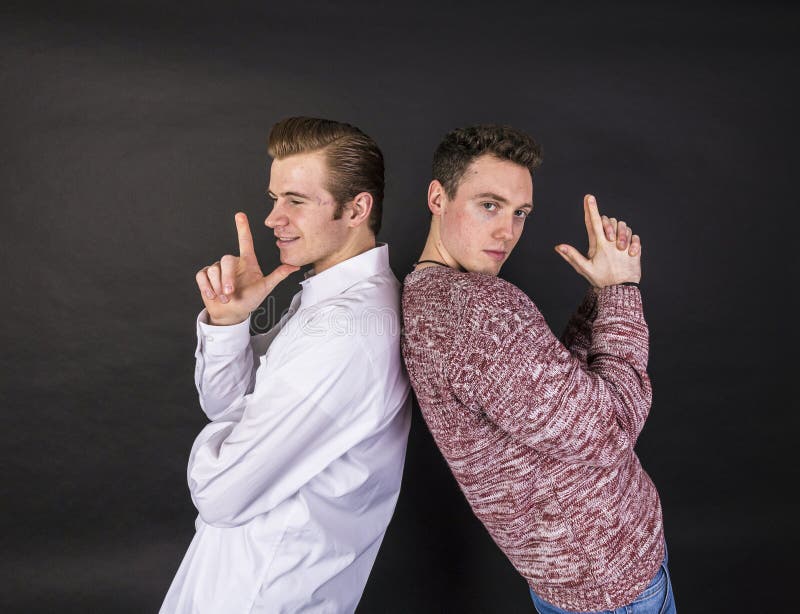 Two Teenage Boys Stand Back To Back and Look Cool Stock Photo - Image ...
