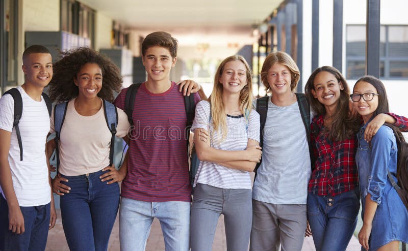 Teenage Classmates Standing in High School Hallway Stock Image - Image ...