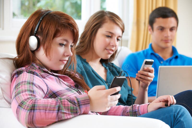 Teenage Friends Using Digital Technology at Home Stock Image - Image of ...
