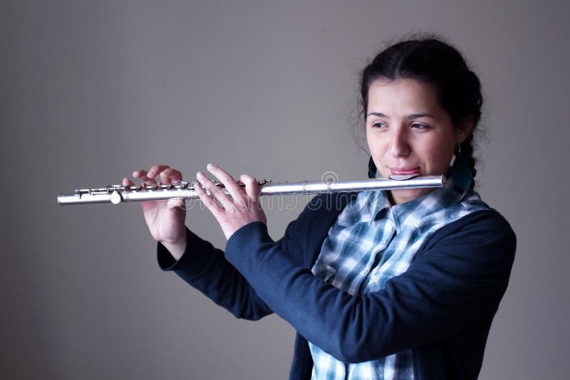 Beautiful Flutist stock image. Image of melody, enjoy, enjoying - 92363
