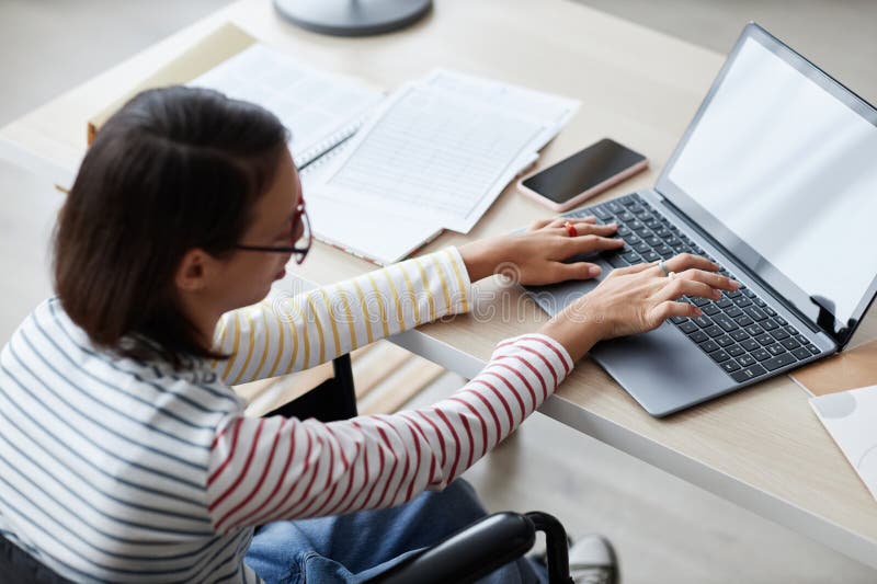 Teenage Girl with Disability Using Computer at Home Studying Online ...