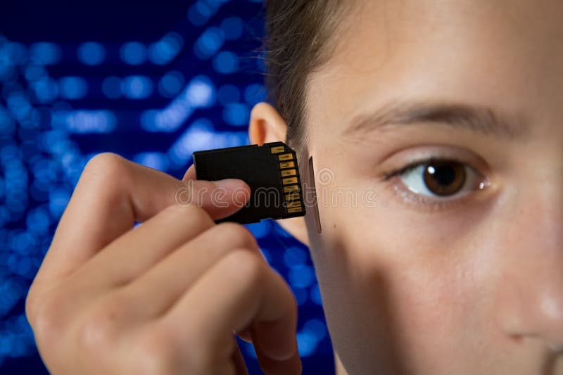Teenage Girl Inserting SD Memory Card into Slot in Her Head. Stock ...