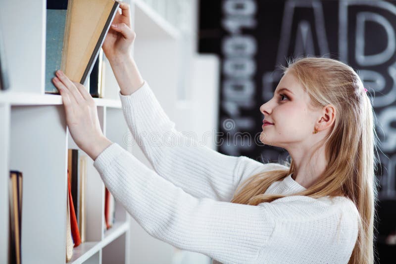 Teenage girl in a library stock photo. Image of campus - 108839362