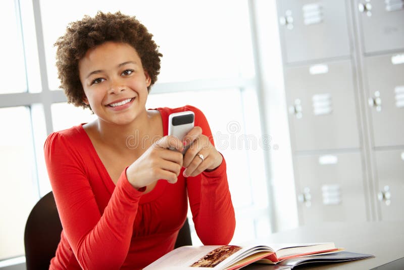 Teenage Girl with Phone in Class Stock Image - Image of enjoying ...