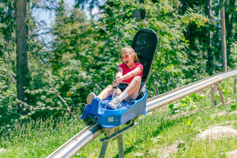 Teenage Girl Screams Going Down a Mountain Roller Coaster Stock Photo ...