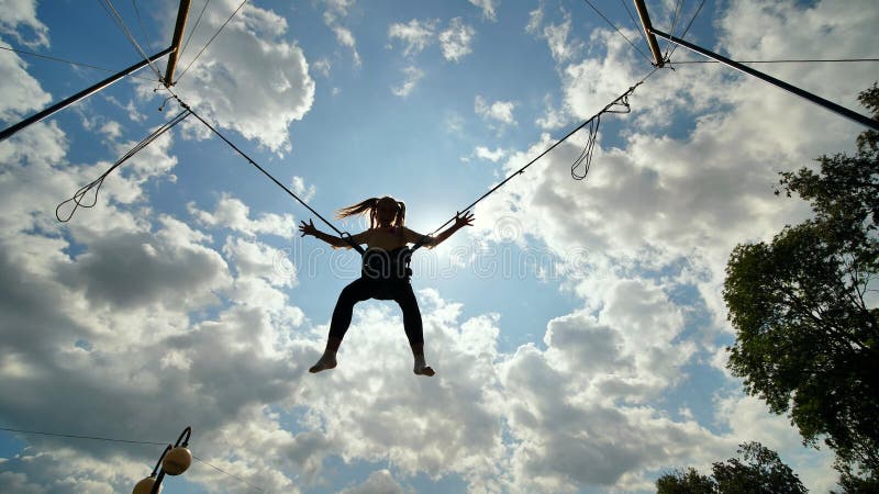 Teenage Girl Silhouette Jumping on the Trampoline Bungee Jumping. Stock ... Teenage Girl Silhouette Jumping on the Trampoline Bungee Jumping. Stock ...