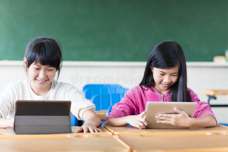Teenage Girls Student Watching the Tablet in Classroom Stock Photo ...
