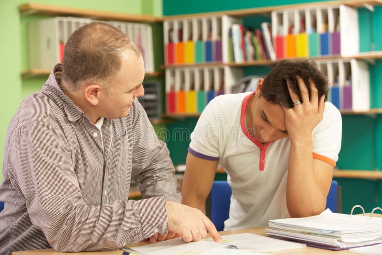 Teenage Student in Classroom with Tutor Stock Image - Image of clothing ...