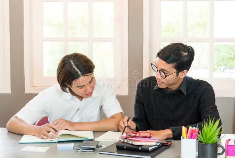 Teenage Student in Classroom with Tutor Stock Photo - Image of reading ...