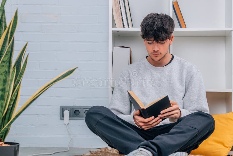 Student at Home or Library Reading a Book or Studying Stock Photo ...