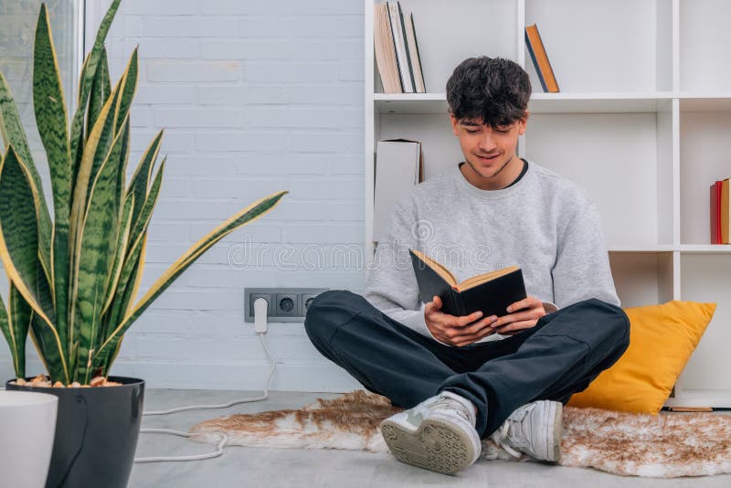Student at Home or Library Reading a Book or Studying Stock Photo ...