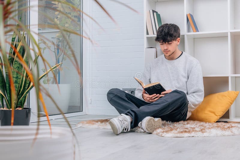 Student at Home or Library Reading a Book or Studying Stock Image ...