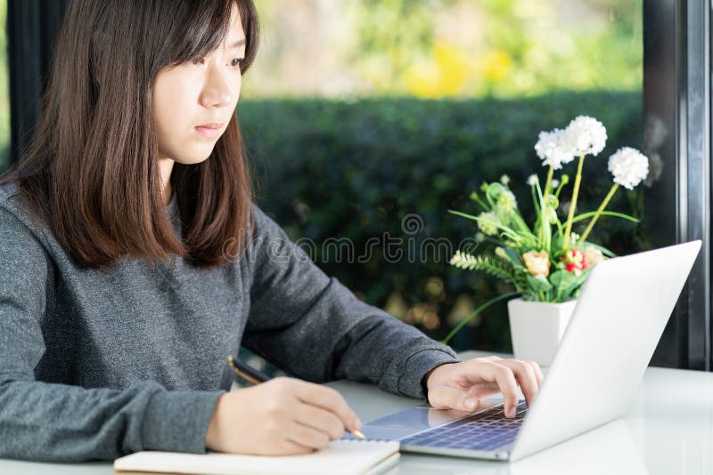 Teenage Student Using Laptop Doing Homework at Home Stock Photo - Image ...