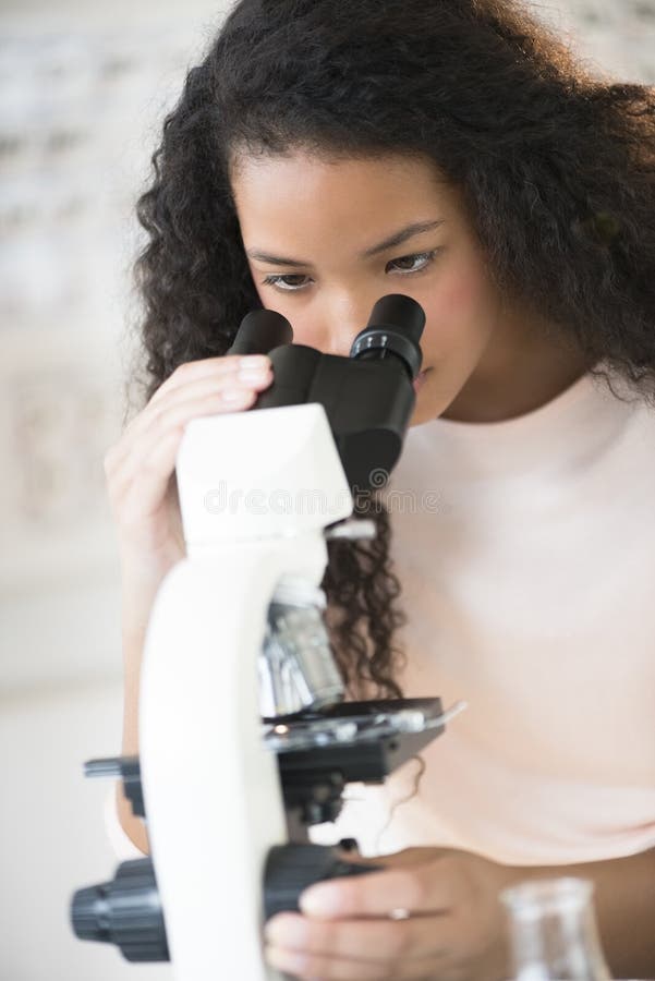 Teenage Student Using Microscope Stock Image - Image of casual ...