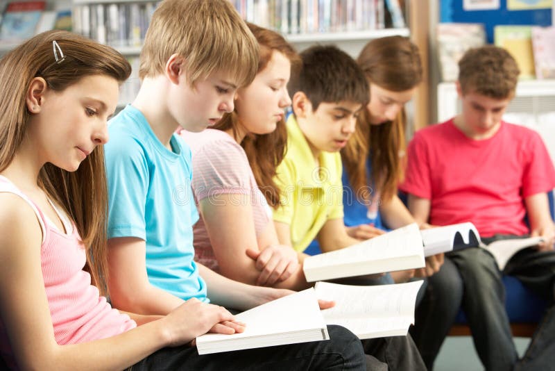 Teenage Students in Library Reading Books Stock Image - Image of male ...