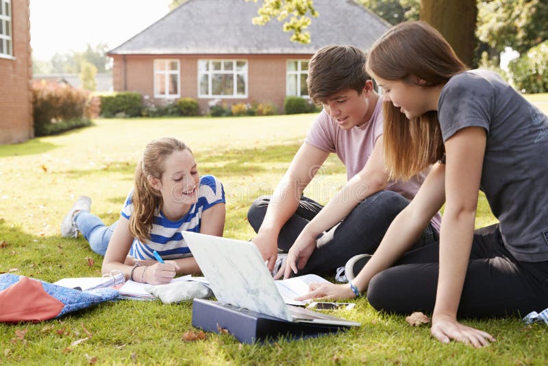 Teenage Students Sitting Outdoors and Working on Project Stock Image ...