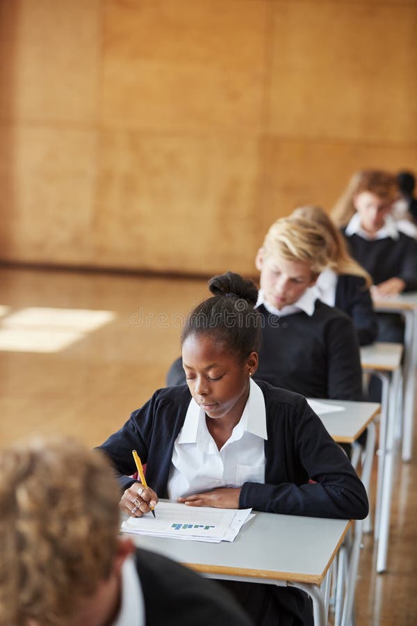 Teenage Students in Uniform Sitting Examination in School Hall Stock ...