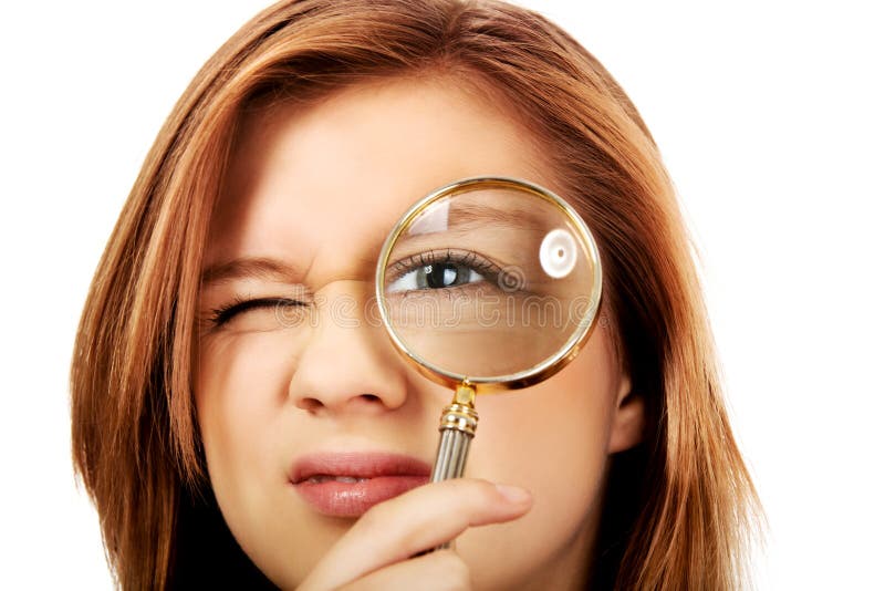 Teenage Woman Looking through a Magnifier Stock Photo - Image of ...