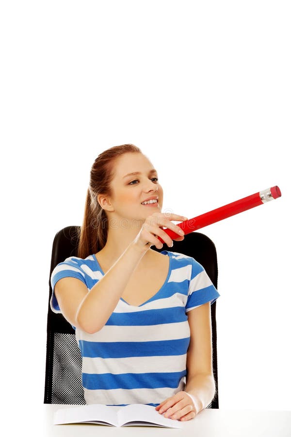 Teenage Woman Pointing for Something with a Huge Pen Stock Image ...