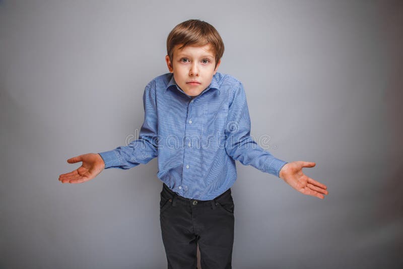 Teenager Boy Shrugs at a Loss Stock Photo - Image of latino, handsome ...