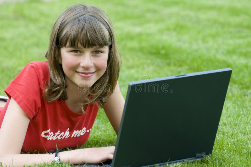 Teenager with Computer on the Grass Stock Photo - Image of technology ...