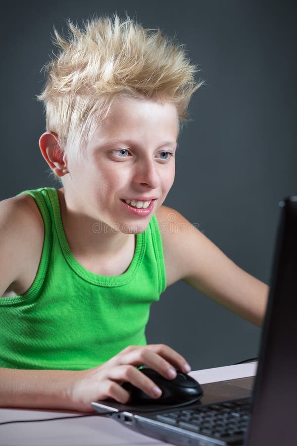 Teenager at a computer stock image. Image of teen, cheerful - 56322843
