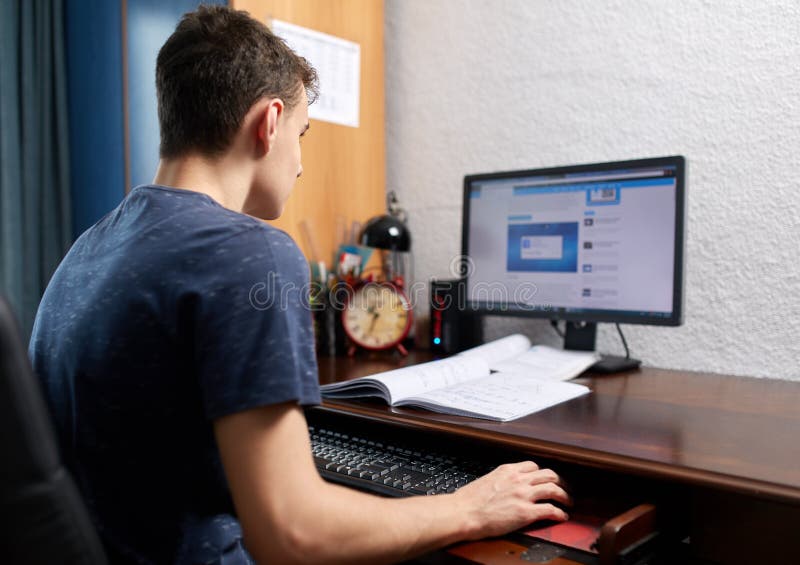 Teenager Doing Homework with Computer Stock Photo - Image of computer ...