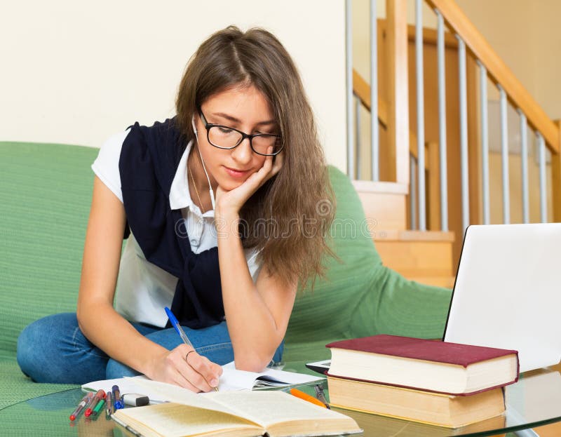 Teenager doing homework stock image. Image of session - 55322033