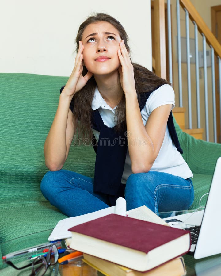Teenager doing homework stock photo. Image of laptop - 55321408