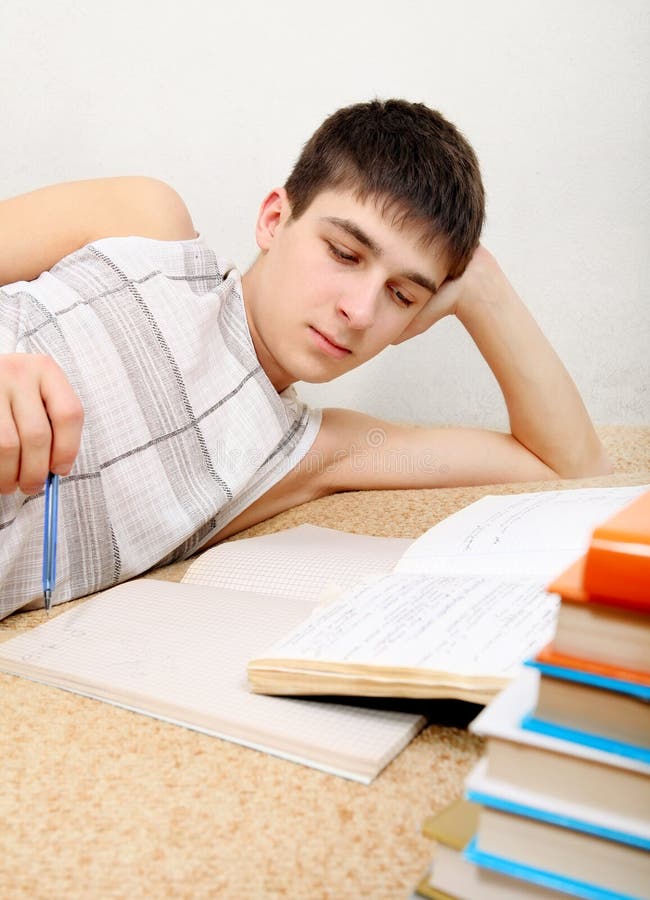 Teenager doing Homework stock photo. Image of paperwork - 40986610