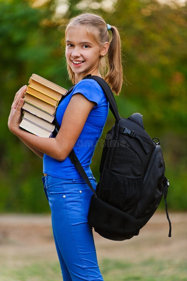 Teenager Girl Holding Stack Stock Image - Image of female, outdoors ...