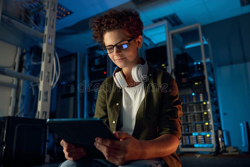 Teenager Guy it Technician Working on Tablet in Server Room Stock Photo ...