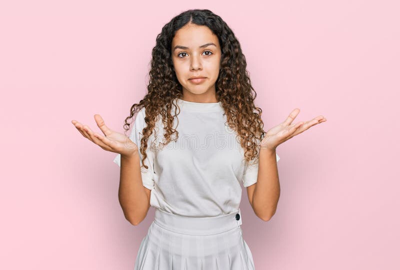 Teenager Hispanic Girl Wearing Casual White T Shirt Clueless And