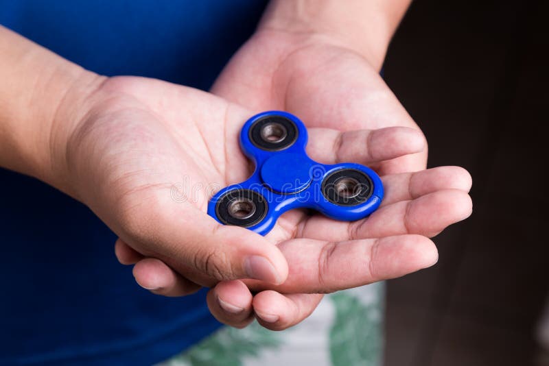 Teenager Holding the Fidget Spinner Stock Photo - Image of craze ...