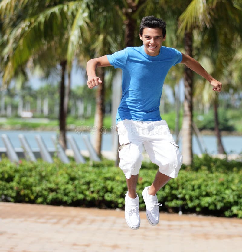 Teenager Jumping in the Park Stock Image - Image of joyful, attractive ...