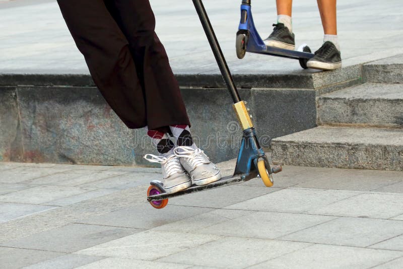 Boy Jumps with Scooter at the Skate Park Over a Ramp Stock Image ...