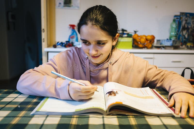 Teenager Performs Homework in the Home Kitchen Stock Image - Image of ...
