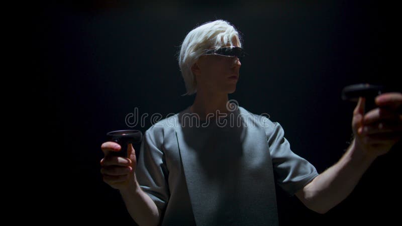 Teenager Playing Augmented Reality Game in Dark Room. Focused Blonde ...