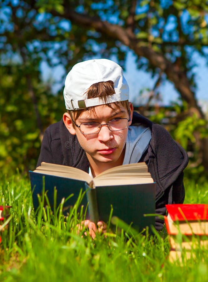Teenager and Kid Read a Book Stock Photo - Image of brothers, outdoors ...
